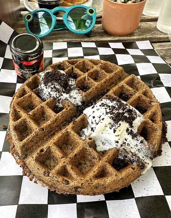 This waffle's got more personality than most people you'll meet today, complete with powdered sugar and chocolate chips galore.