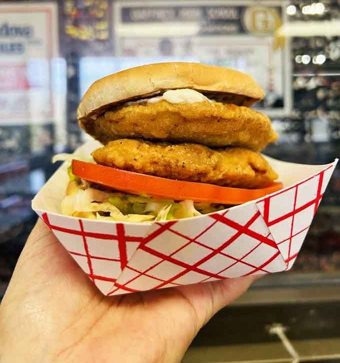 Two chicken patties on a bun sounds simple until you see this masterpiece that redefines what a sandwich can be.