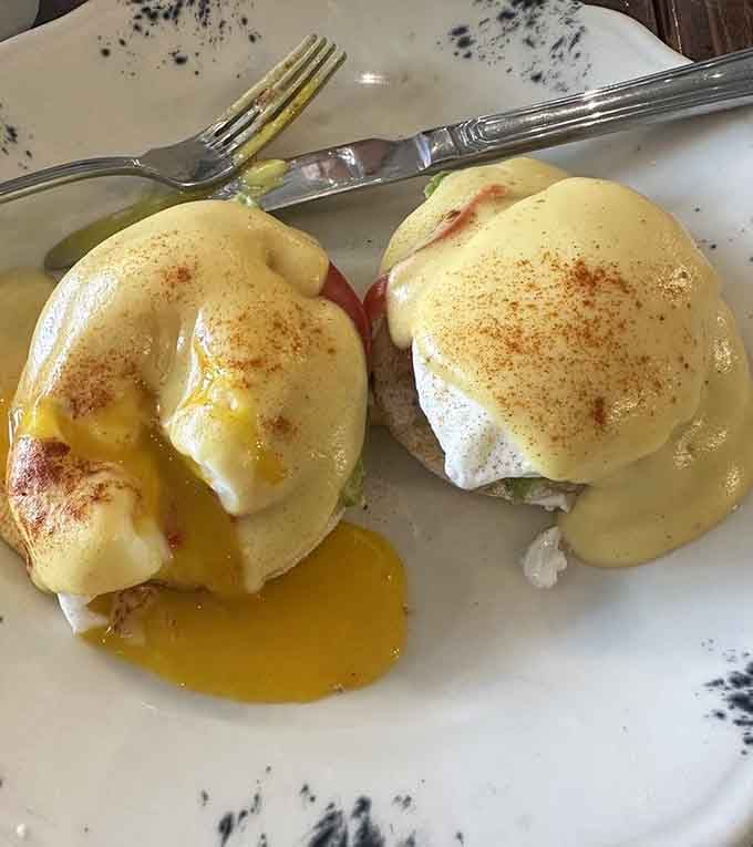 Eggs Benedict so beautiful it deserves its own Instagram account, hollandaise cascading like liquid gold.
