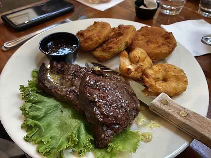 That ribeye means business, flanked by fried sides that understand their supporting role in this delicious production perfectly.