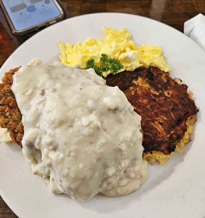 When sausage gravy cascades over chicken fried steak like a delicious avalanche, resistance becomes completely futile and unnecessary.