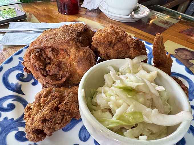 Golden fried chicken so crispy it practically crackles, served with coleslaw that actually looks like someone cares about vegetables.
