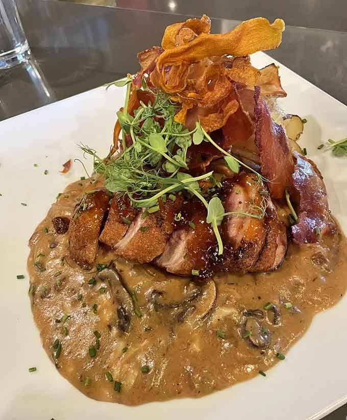 Duck breast plated like fine art, topped with crispy delights that make you forget you're miles from anywhere.