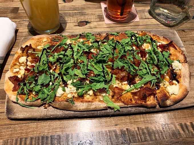 Bacon and fig on flatbread with arugula&mdash;it's like someone turned sophistication into something you can actually eat.