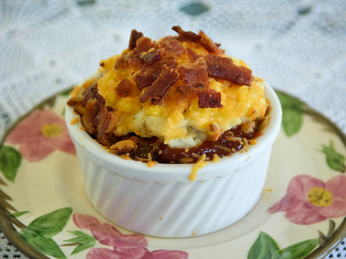 This towering meatloaf pie arrives like comfort food's greatest hit album, complete with cheese and bacon for maximum Southern soul satisfaction.