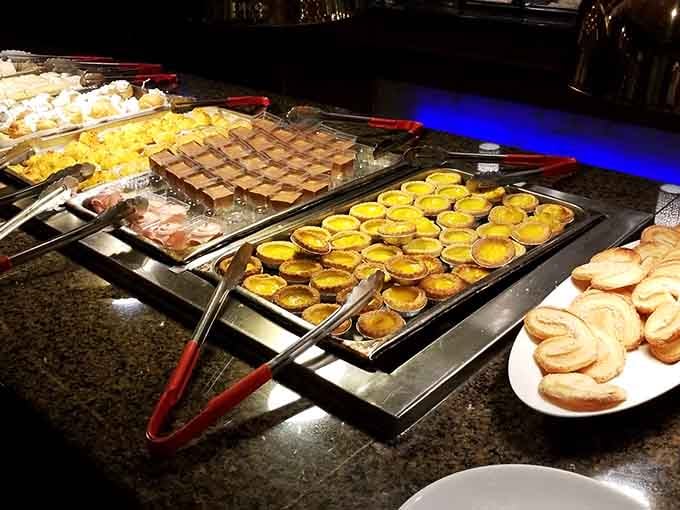 Tarts and pastries lined up like sweet little soldiers, ready to make your dessert plate dreams come true.
