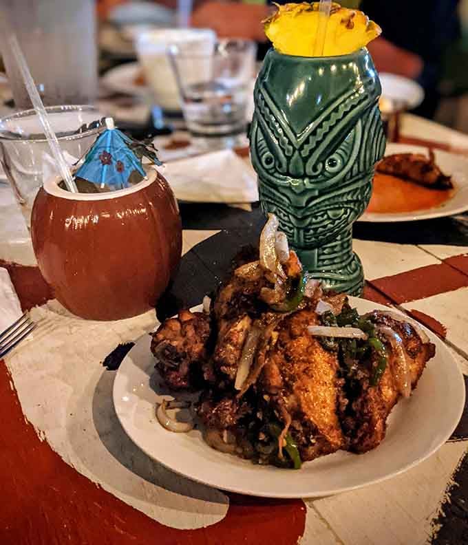 Five spice wings paired with tiki mugs because sometimes dinner needs to look as good as it tastes.