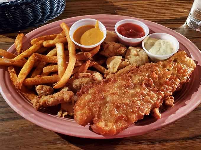 Three pieces of beer-battered heaven nestled in checkered paper, proving Kentucky knows its way around quality seafood after all.