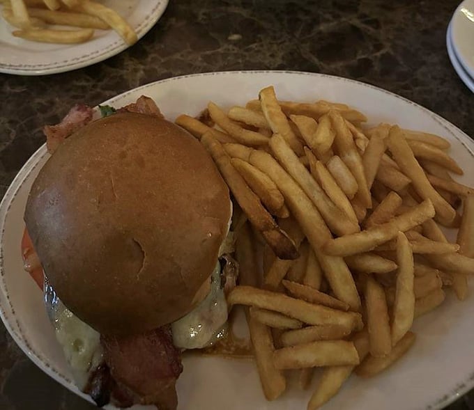 A burger this perfectly constructed deserves its own architectural award, melted cheese and all included in the blueprint.