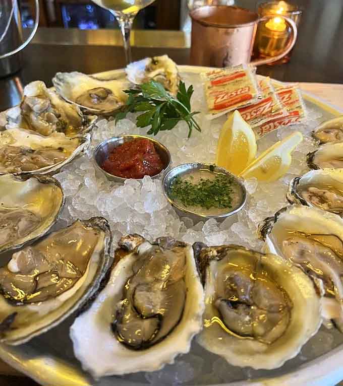 Fresh oysters on ice with mignonette and lemon wedges prove that simple pleasures are often the best pleasures.