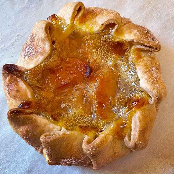 This individual peach pie looks like summer captured in pastry form, ready for its close-up.