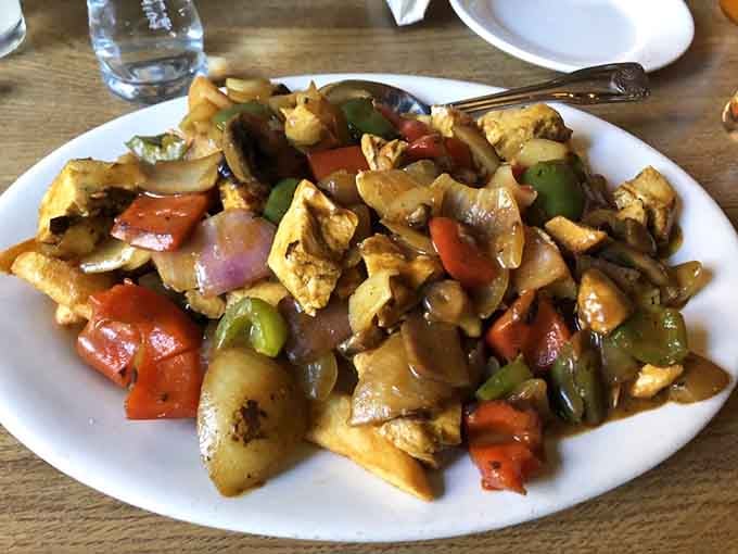 Colorful peppers and tender chicken in curry sauce prove Irish pubs know their way around global flavors.