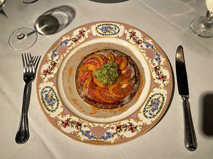 This tomato tart on ornate china looks almost too beautiful to eat, but you absolutely should anyway, trust me.