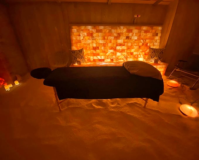 The massage table surrounded by glowing salt blocks creates an ambiance so peaceful, your stress starts melting before the session even begins.