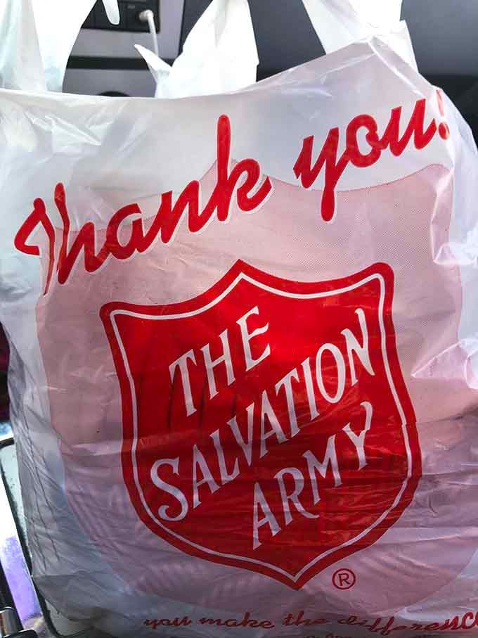 The iconic red shield bag means you've scored deals and supported a good cause simultaneously. Win-win.