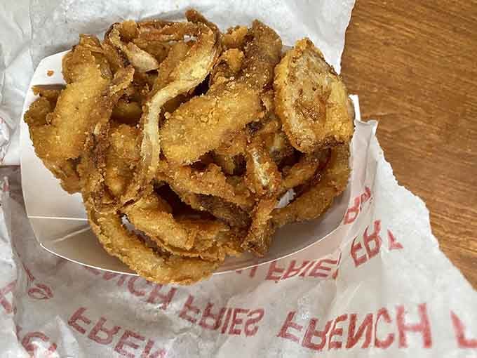Onion rings so perfectly golden and crispy, they deserve their own standing ovation and encore performance.