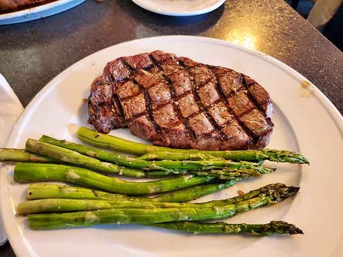 That ribeye char is textbook perfection, paired with asparagus that actually looks like it wants to be eaten.