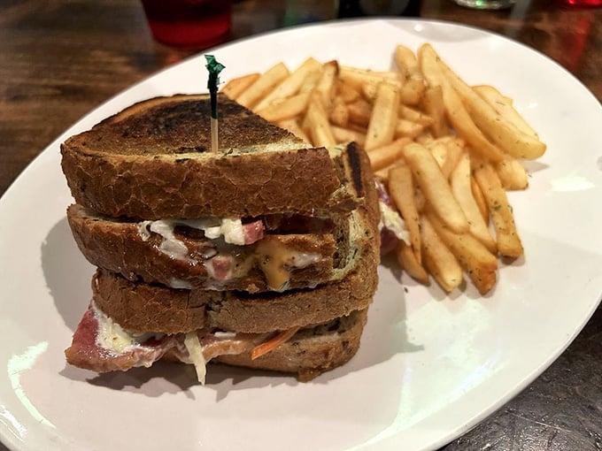 This towering Reuben sandwich is stacked so high it practically needs its own zip code and architectural support.