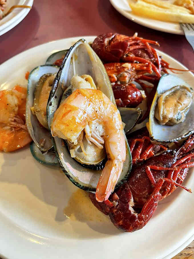 Mussels, shrimp, and seafood treasures arranged like edible jewels waiting for their moment to shine on your plate.