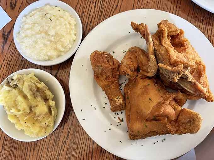Fried chicken so crispy it practically crackles, served with sides that complete the Southern symphony perfectly.