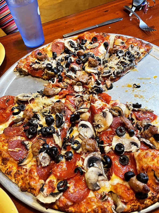 Pepperoni, sausage, mushrooms, and olives create a symphony of flavors that'll make your taste buds stand up and cheer.