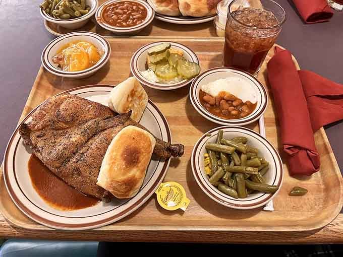 Fried chicken with rolls and a rainbow of sides on a cafeteria tray represents everything right about traditional Texas dining.