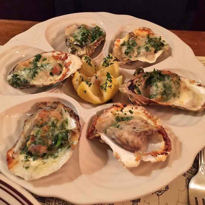 Baked oysters bubbling with butter and herbs, proving that perfection sometimes needs a little heat.