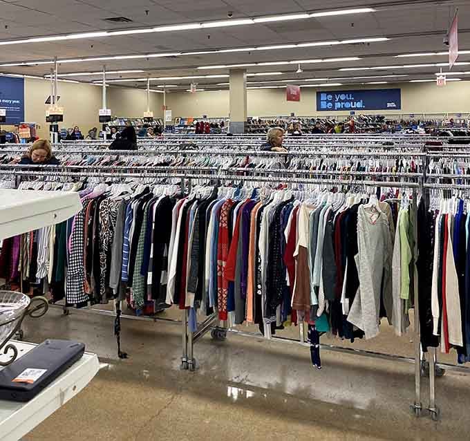 Clothing racks stretch into infinity, proving that one person's closet purge is another person's wardrobe jackpot.