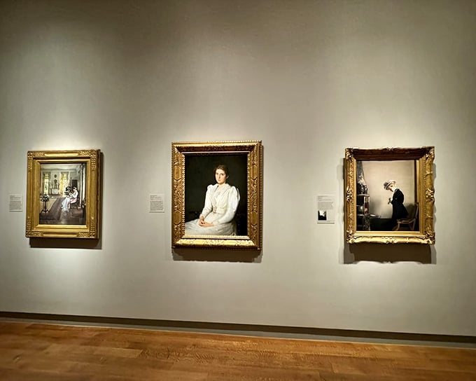 Three portraits hanging together like they're having the world's quietest, most dignified conversation about the good old days.