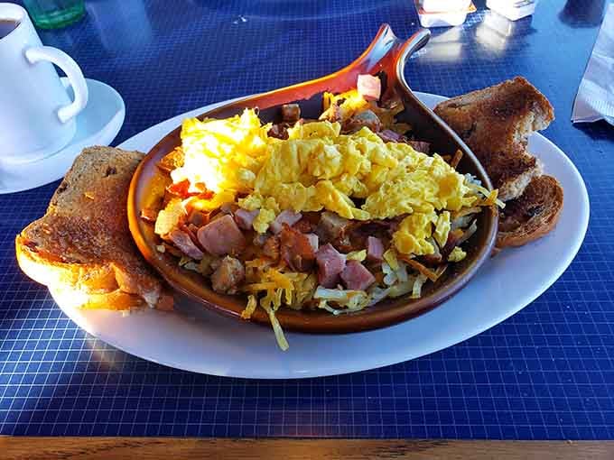This loaded breakfast skillet is what happens when someone decides eggs deserve to party with all their favorite friends.