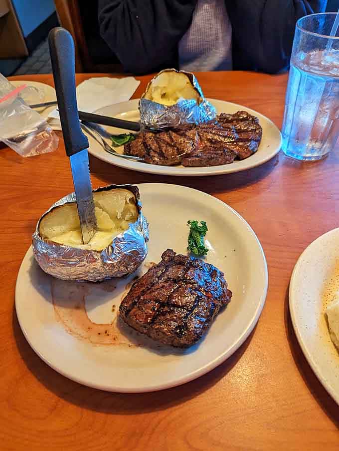 Two gorgeous steaks with fluffy baked potatoes&mdash;this is what dinner dreams are made of, folks.