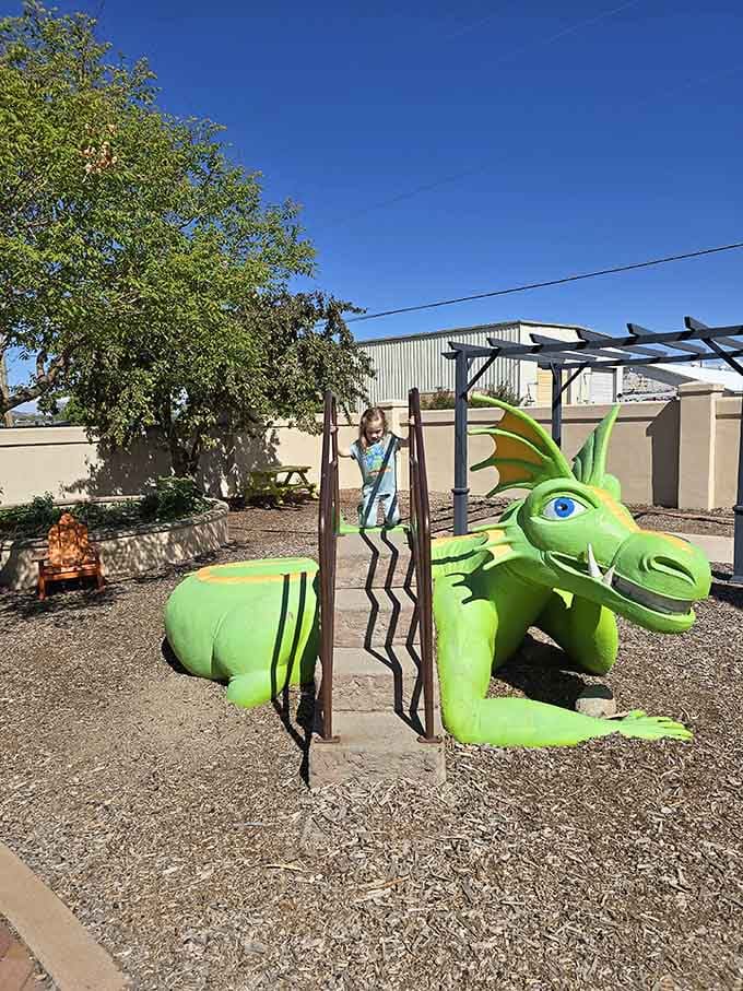 Kids conquer this cheerful dragon slide while parents wonder if their homeowner's insurance covers backyard mythical creatures.