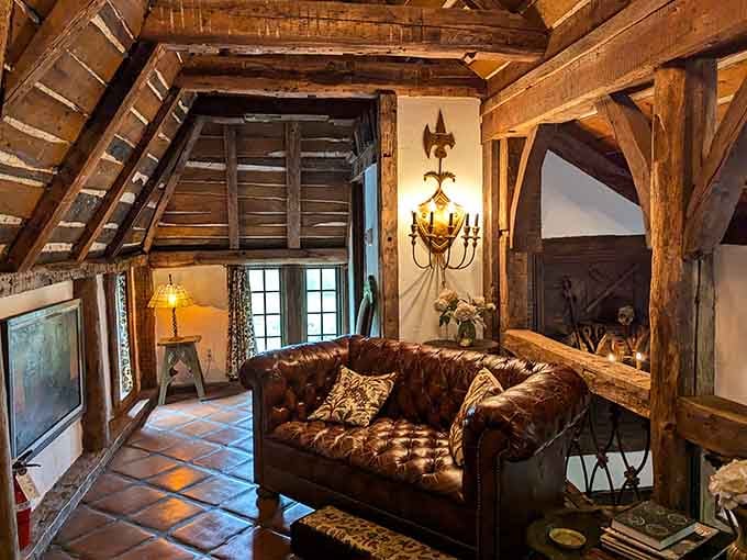 Exposed beams, tufted leather, and a loft ladder, this room laughs at your boring hotel chains.