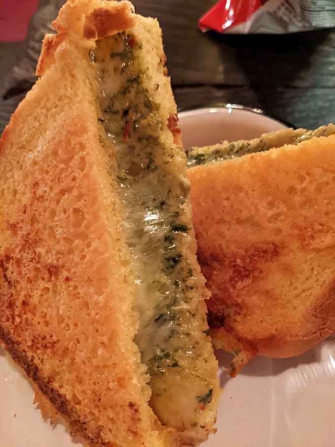 That golden, crispy exterior promises melted cheese and spinach artichoke goodness with every bite.