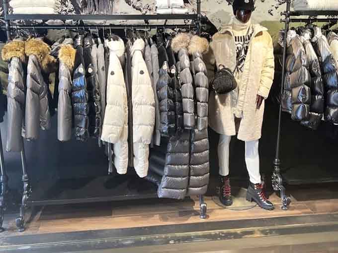 Winter coats hanging like a puffy army ready to protect you from the elements while keeping your style game strong.