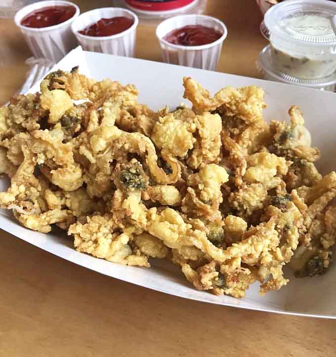 These aren't just fried clams, they're crunchy little pillows of oceanic joy that'll ruin you forever.