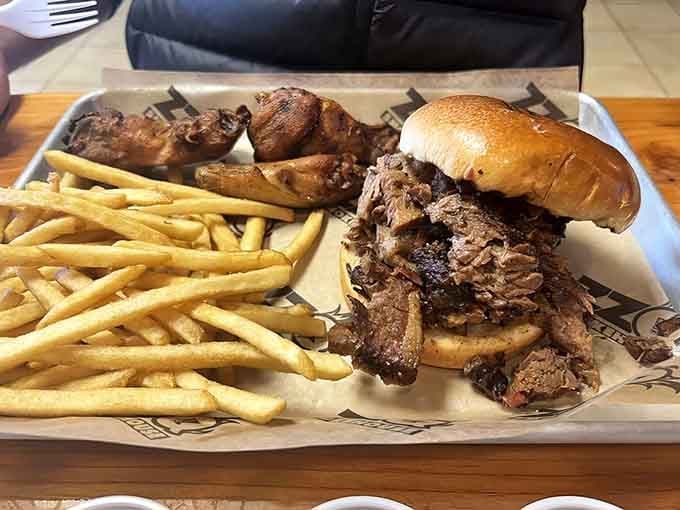 That brisket sandwich is piled so high, you might need an engineering degree to figure out the best angle of attack.