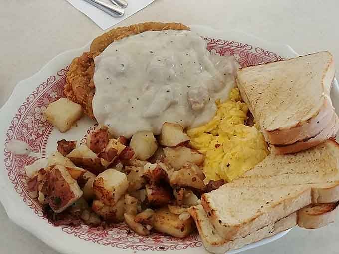 Chicken fried steak drowning in gravy, served with eggs and toast for the truly ambitious eater.