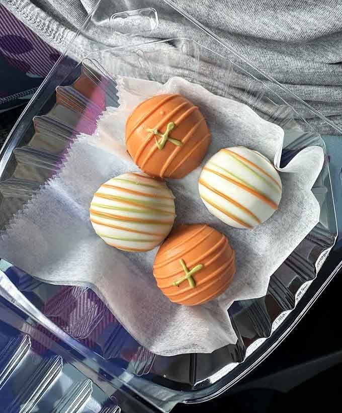 Pumpkin-themed cake balls that bring autumn vibes any time of year, proving seasonal treats don't need a calendar.