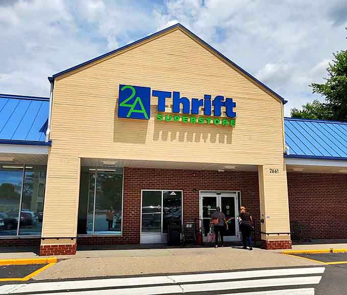 That cheerful yellow exterior with blue accents practically radiates good vibes and promises of amazing finds waiting just inside.