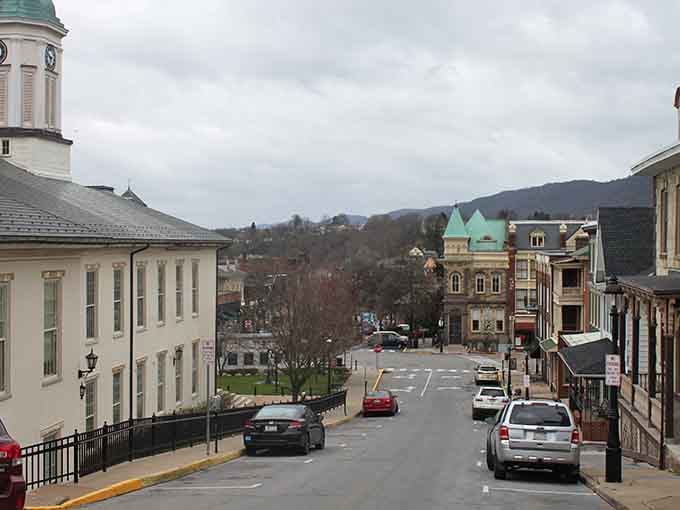 Victorian buildings lining mountain-framed streets create a postcard-perfect scene that time forgot to change.
