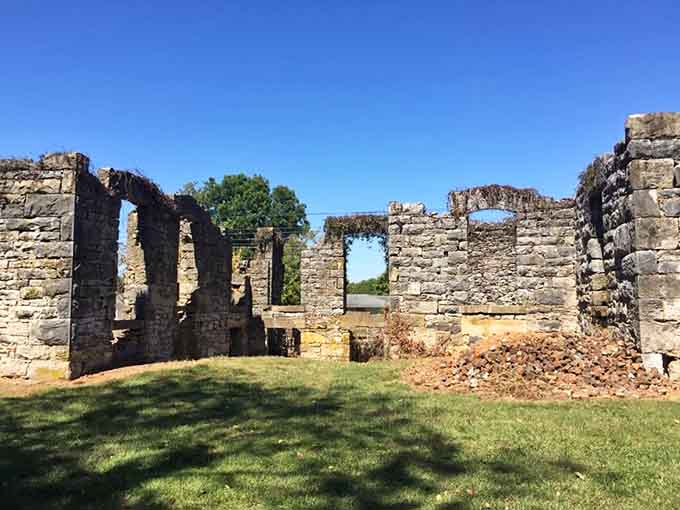 These limestone walls framed doorways where weary travelers once sought shelter, food, and probably gossip about the road.