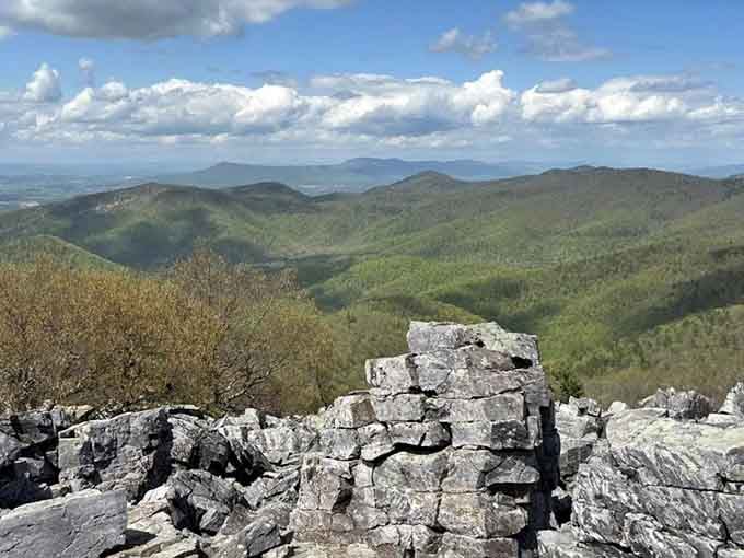 Ancient stone slabs create a natural throne room atop the summit, where clouds and mountains bow before your arrival.