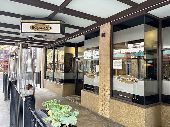 Dark wood beams and warm lighting create that timeless steakhouse atmosphere where every guest feels like a regular.