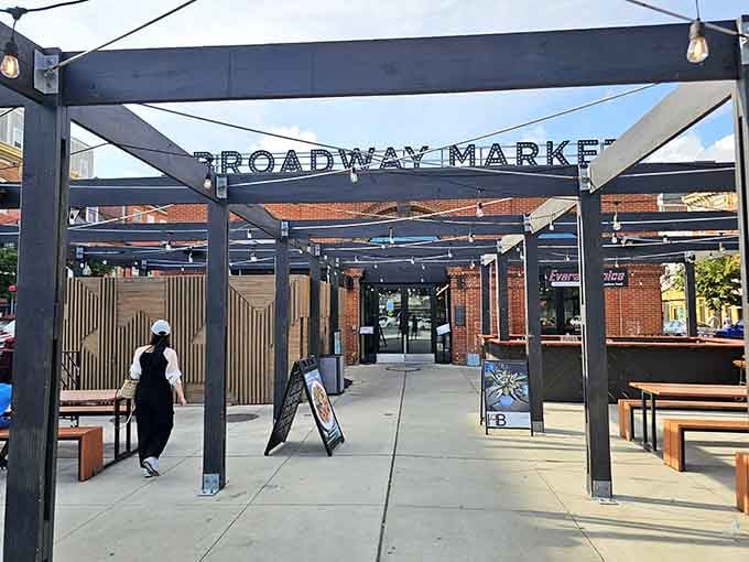 The modern Broadway Market entrance frames a welcoming pathway where food, community, and commerce beautifully intersect.