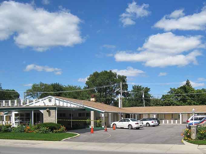 Classic suburban charm meets perfectly manicured flower beds—this is the kind of welcoming entrance that says "home."