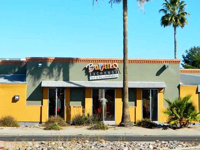 Bright yellow walls and palm tree shadows create a cheerful vibe that makes secondhand shopping feel like vacation.