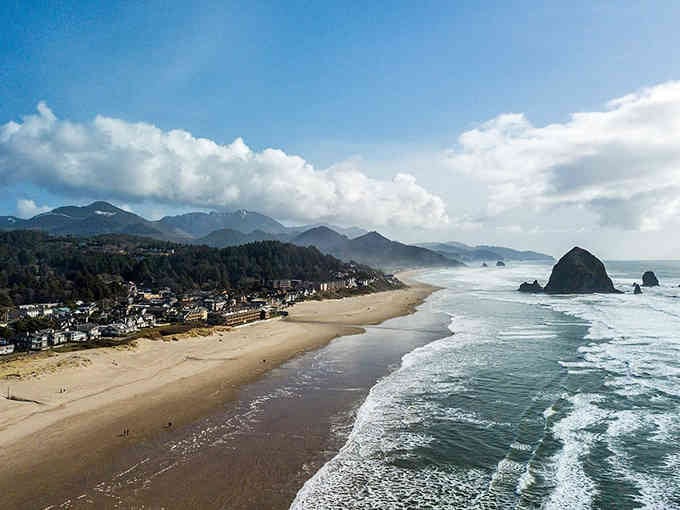 Haystack Rock dominates Cannon Beach's shoreline like a natural cathedral rising from the Pacific's endless blue.