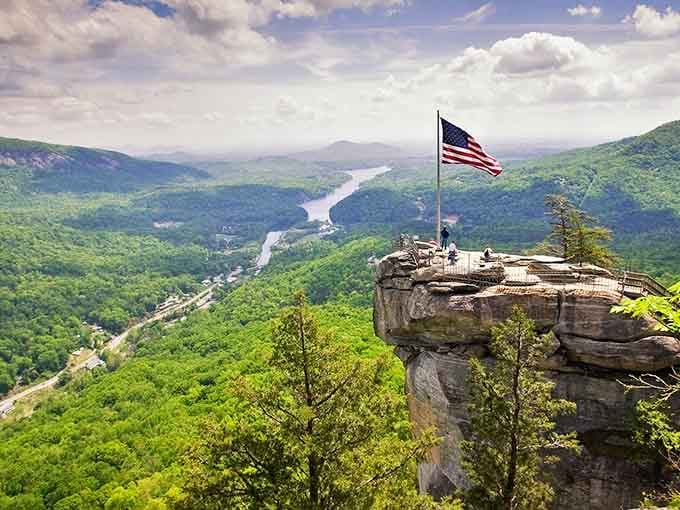 Stars and Stripes wave proudly above Lake Lure's sparkling waters, where Hollywood movies come to life in real time.