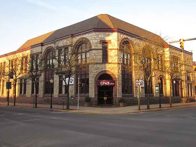 Golden hour kisses this stone building's arches, creating shadows and light that photographers dream about capturing forever.